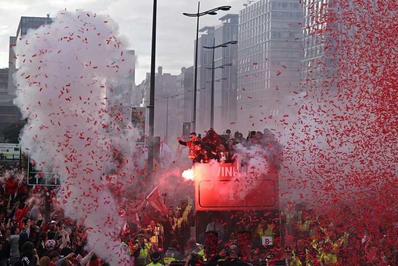 Liverpool celebrate cup wins with fans despite Champions League loss